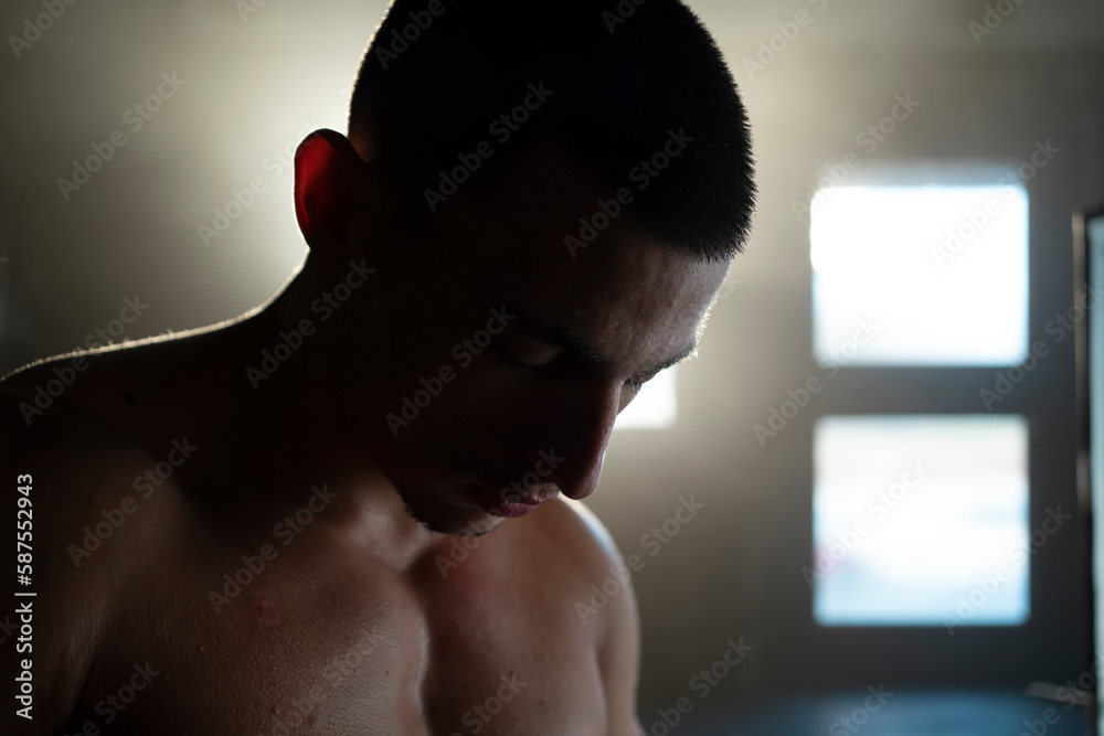 Sweaty shirtless young man becomes sweaty after an intense workout ...