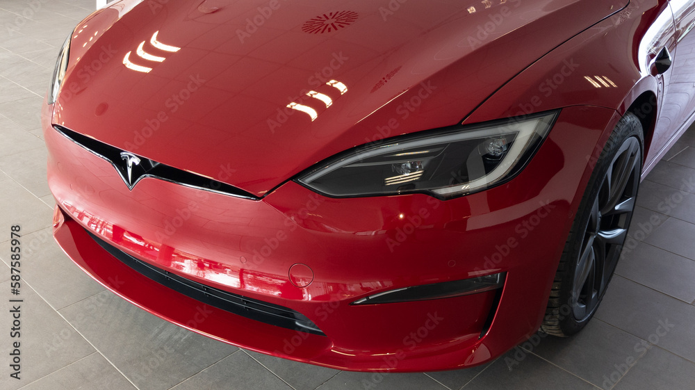 tesla model s logo brand and t sign text front of car hood in showroom ...
