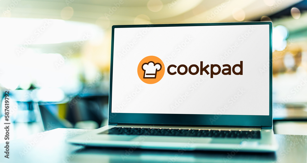 Laptop displaying logo of Cookpad Stock Photo | Adobe Stock