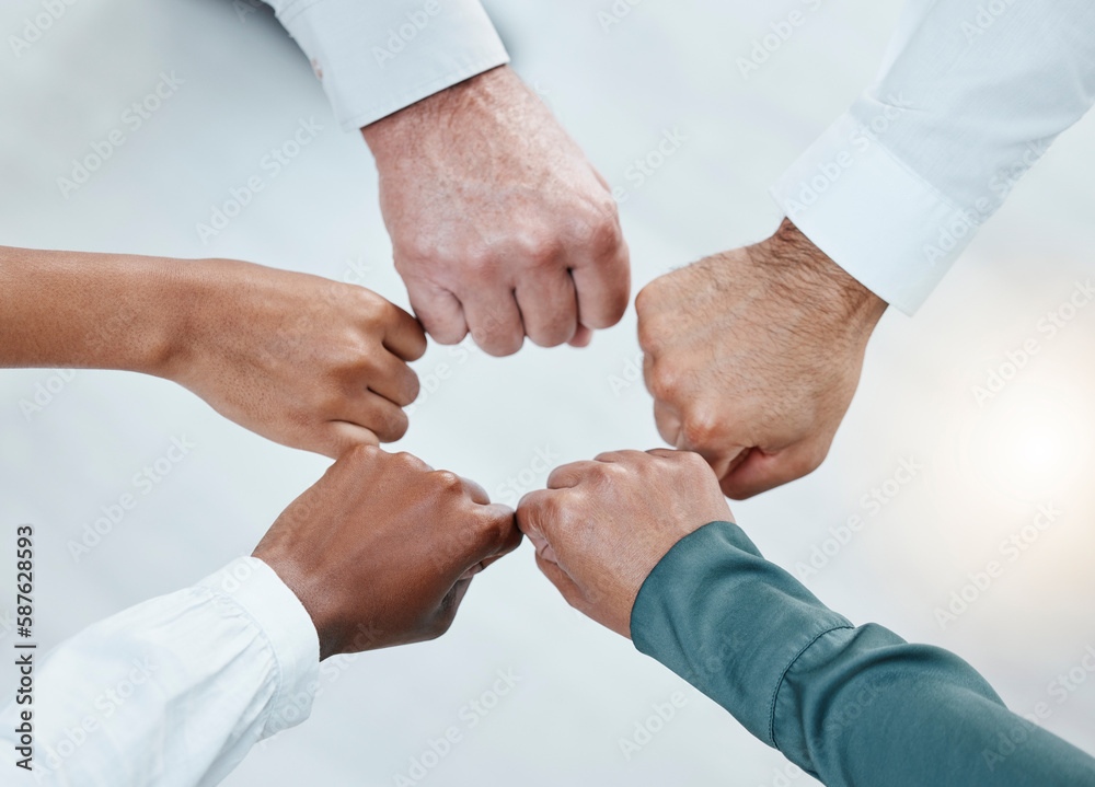 Teamwork, fist bump and hands of business people together for ...