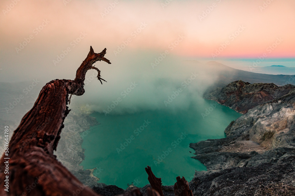 Sunrise over Kawah Ijen Volcano revealing acid turquoise lake and toxic ...