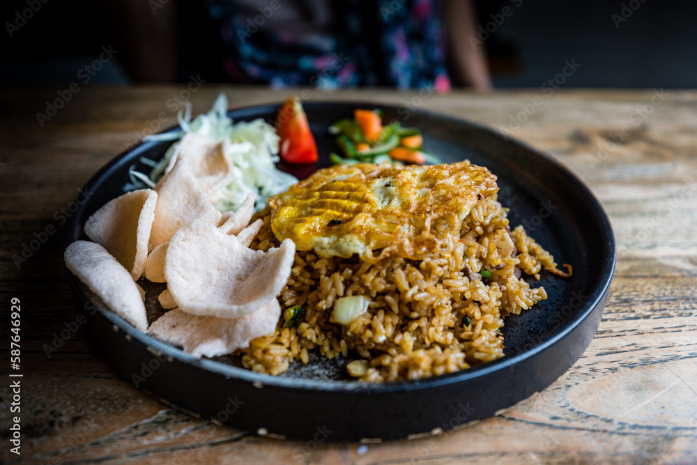 Traditional indonesian cuisine nasi goreng (fried rice) with fried egg ...