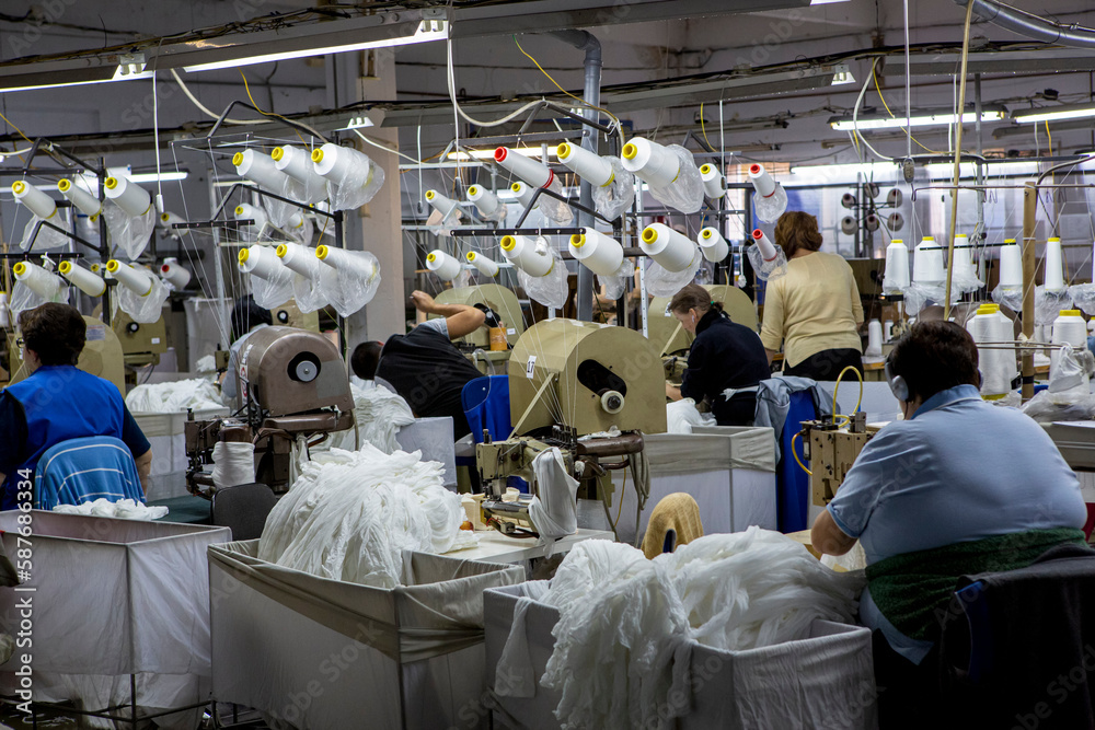 Foto de production of capron tights. Textile factory with machines and ...
