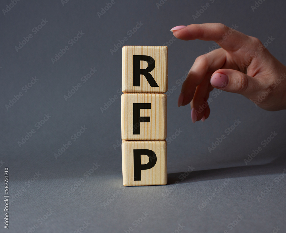 RFP - Request for Proposal. Wooden cubes with word RFP. Businessman ...
