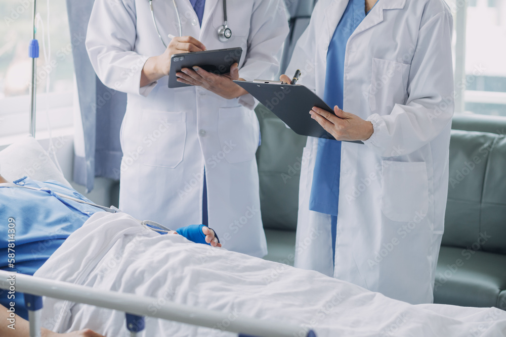 Man with broken arm in cast lying on bed in hospital. The emergency ...