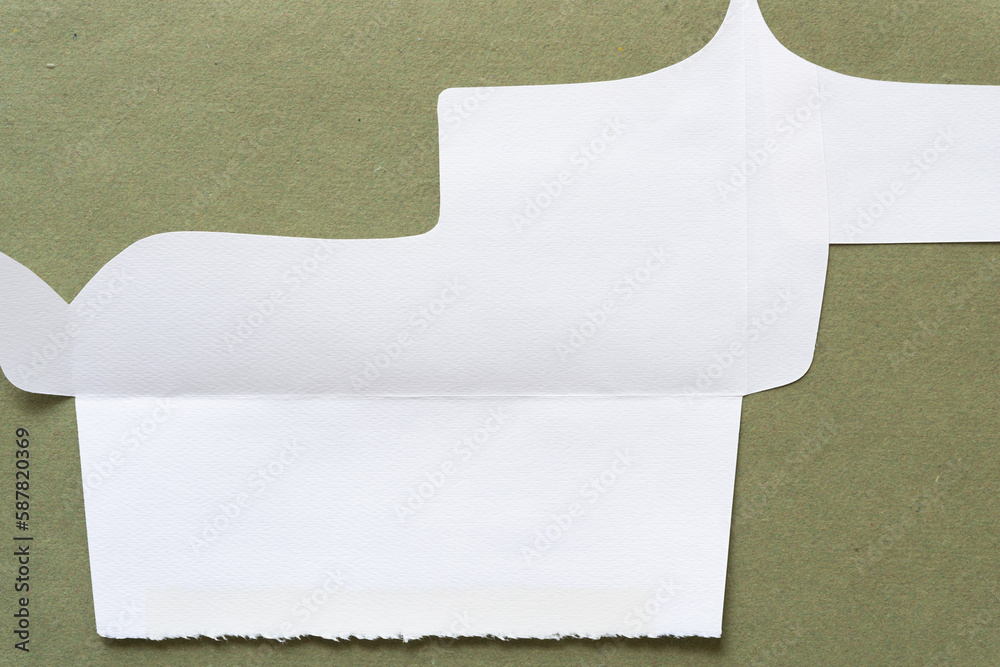 cut white paper shape with distinct wavy and straight edge forms on ...