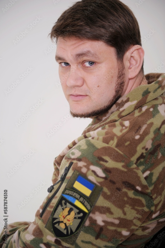 Ukrainian soldier wearing military uniform with flag and chevron ...