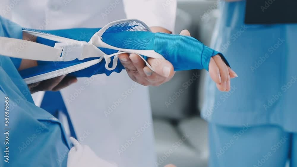 Man with broken arm in cast lying on bed in hospital. The emergency ...