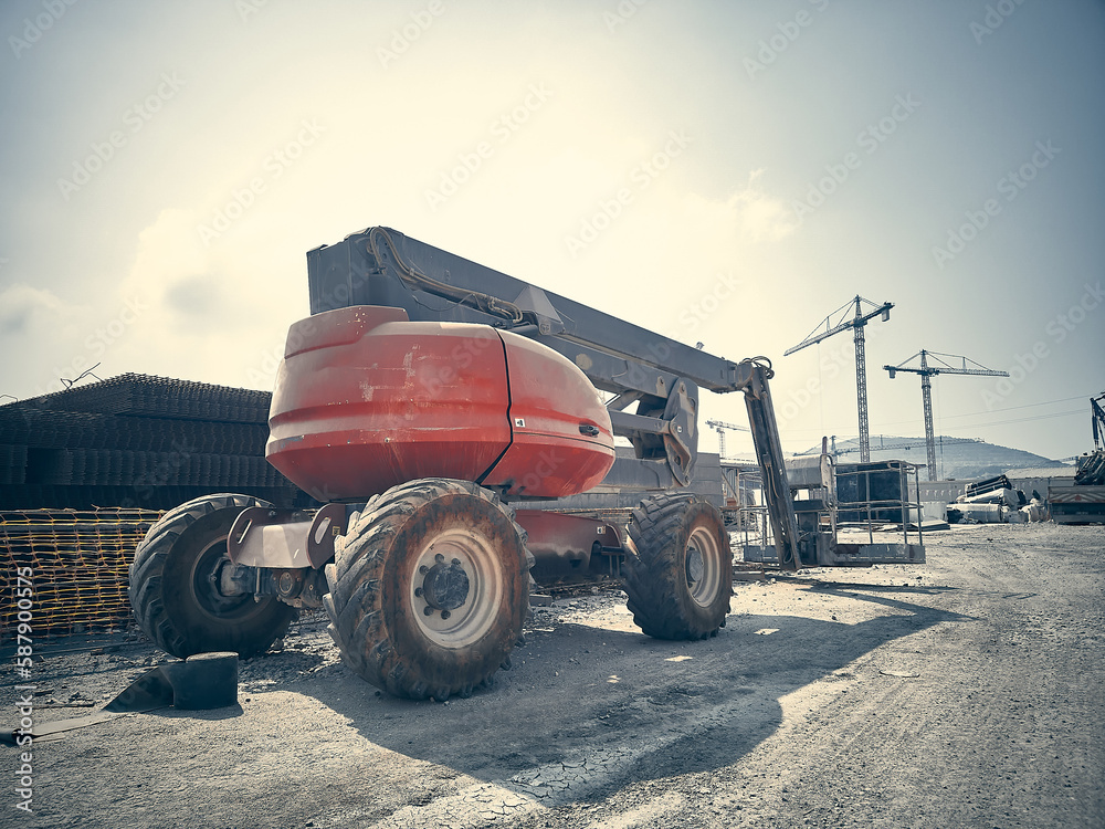 Articulated telescopic elevator. Boom lift picker at construction site ...