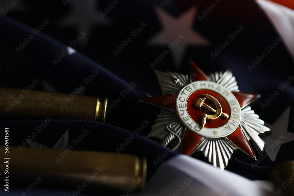 Many bullets cartridges and medals on United States flag. Concept of ...