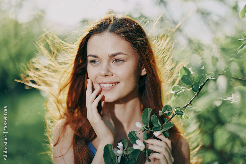Beautiful woman smile close-up face with long red hair flying hair near ...