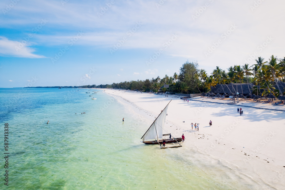 Zanzibar Island boasts a stunning tropical beach featuring white sand ...