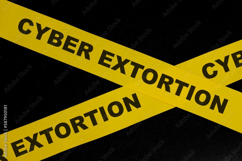 Cyber extortion caution and warning concept. Yellow barricade tape with ...