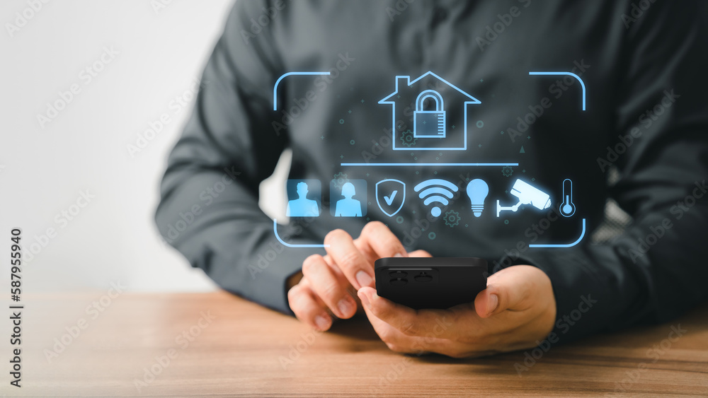 Adult man controlling technology AI smart home devices using a ...