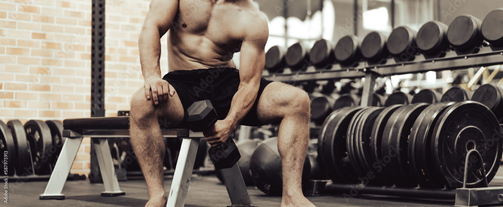 Muscular man bodybuilding muscle by arm lift dumbbell exercise in ...