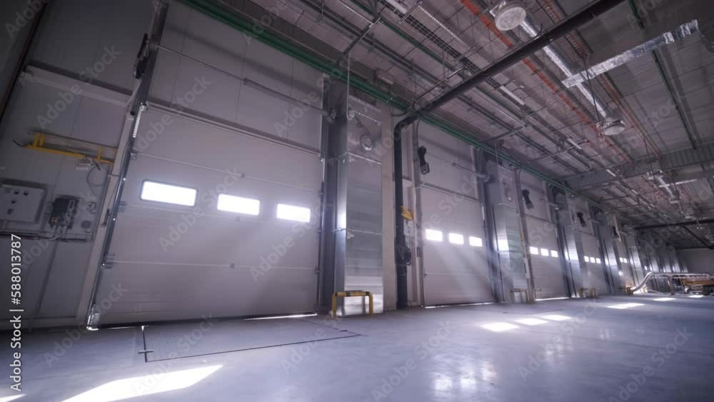 Construction process of a big, modern warehouse with multiple garage ...