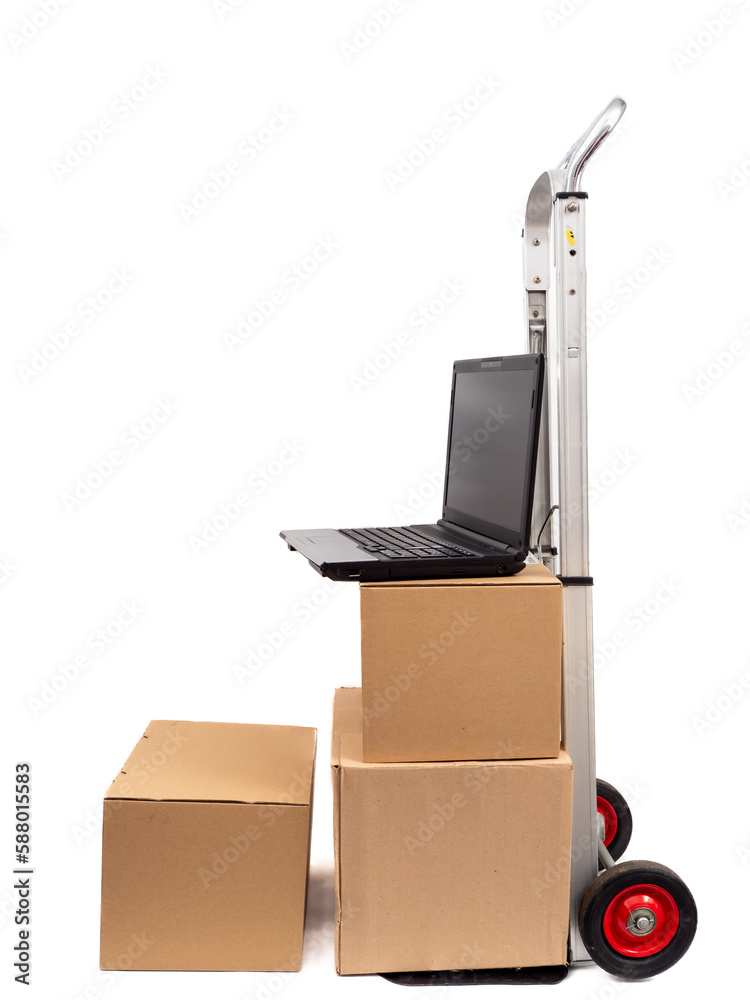 Cardboard boxes with a trolley and a laptop on a white background ...