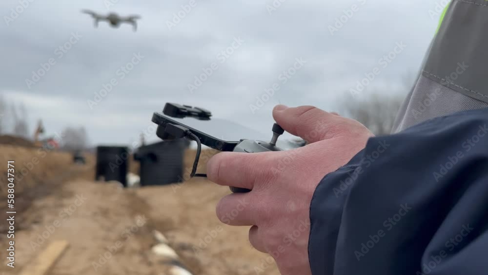 Geodesic quadcopter. A human surveyor. Launching a quadcopter over a ...