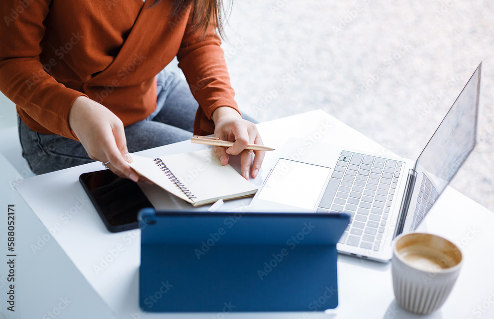Asian teenage woman study online class at home taking notes working ...