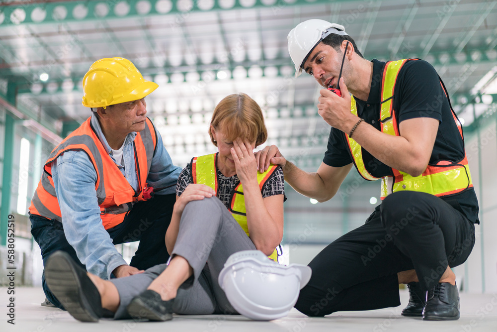 Emergency help engineers provide first aid to construction workers in ...