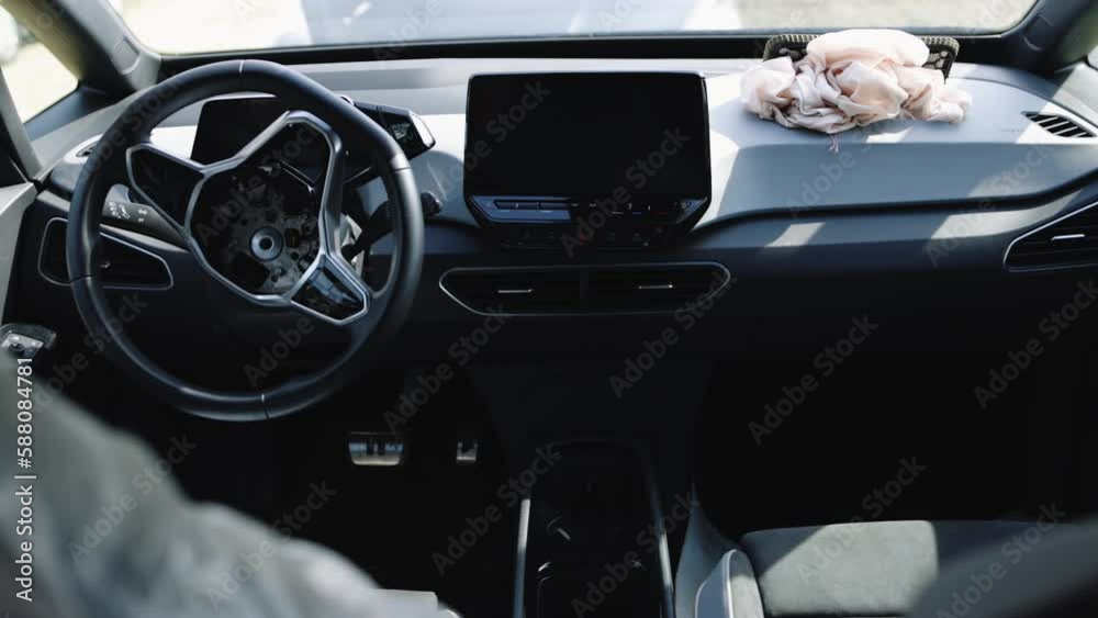Car interior after an accident with airbags deployed. View from inside ...