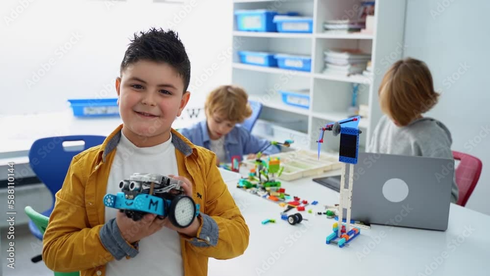 Robotics programming class. Children construct and code Robot. STEM ... Robotics programming class. Children construct and code Robot. STEM ...