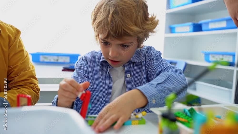 Robotics programming class. Children construct and code Robot. STEM ...