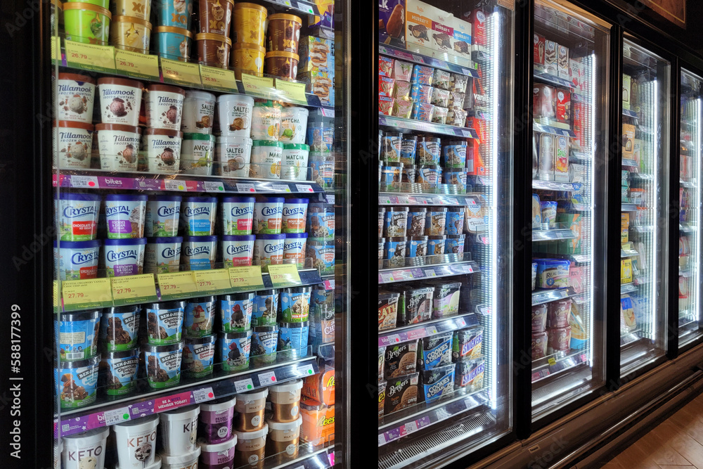 PENANG, MALAYSIA - 2 APR 2023: Interior view of huge glass freezer with ...