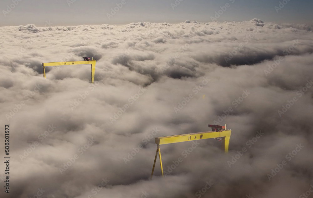 Aerial view of Samson and Goliath Cranes in heavy fog at Harland and ...