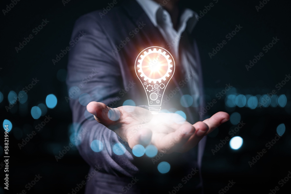 Innovation. Business man hand holding light bulb for Concept of new ...