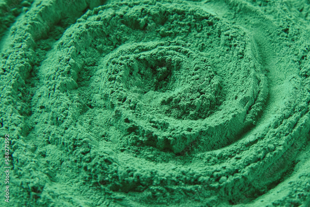 Chlorella or spirulina algae green powder is spinning, rotation ...