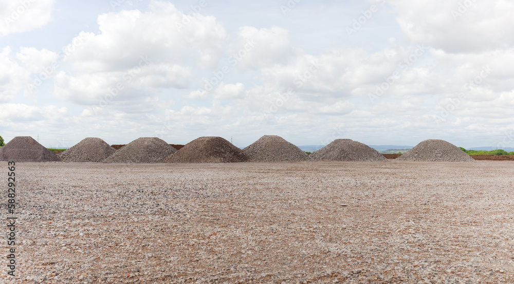 entrance construction site, driveway of building site. Pile of sand and ...