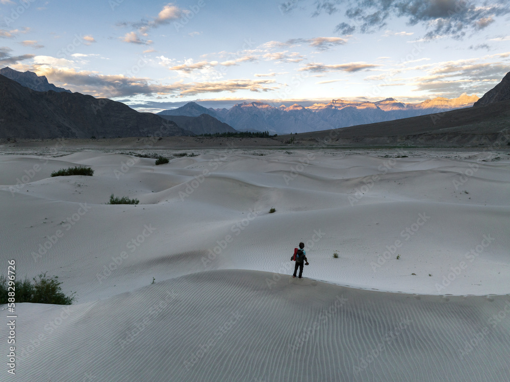 Aerial view of a person on the sand dune, Shigar, Gilgit Baltistan ...