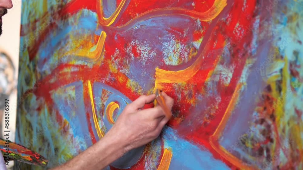 Closeup picture, artist creates mesmerizing art with brushstrokes ...