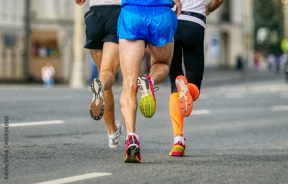 back legs three runners runing marathon, male athletes jogging city ...