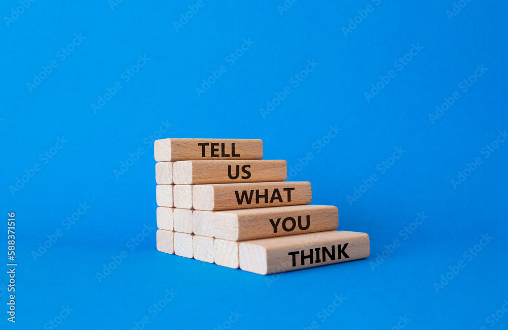 Tell us what you think symbol. Wooden blocks with words Tell us what ...
