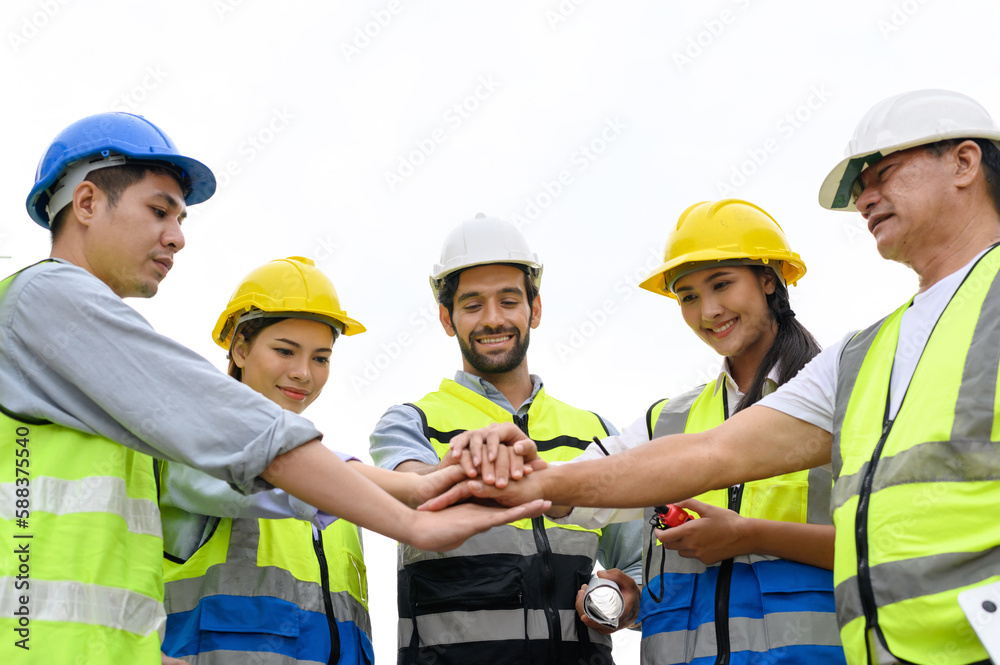 Group of contractors, engineers and formats in safety vests with ...