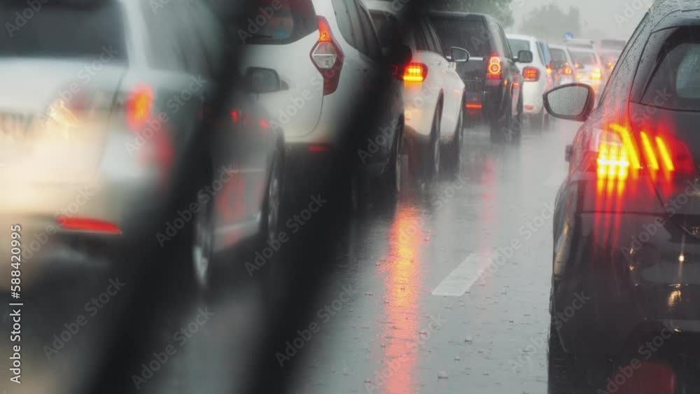 Driving in bad weather conditions and blocked in traffic jam. Lots of ...