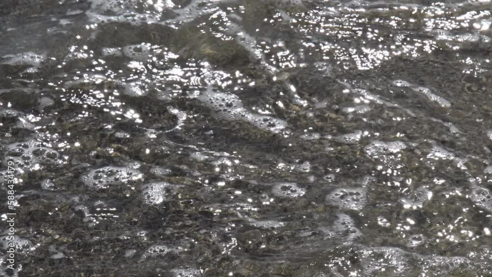 Sea surf waves wash sandy shore at beach. Black Sea water closeup. Sea ...