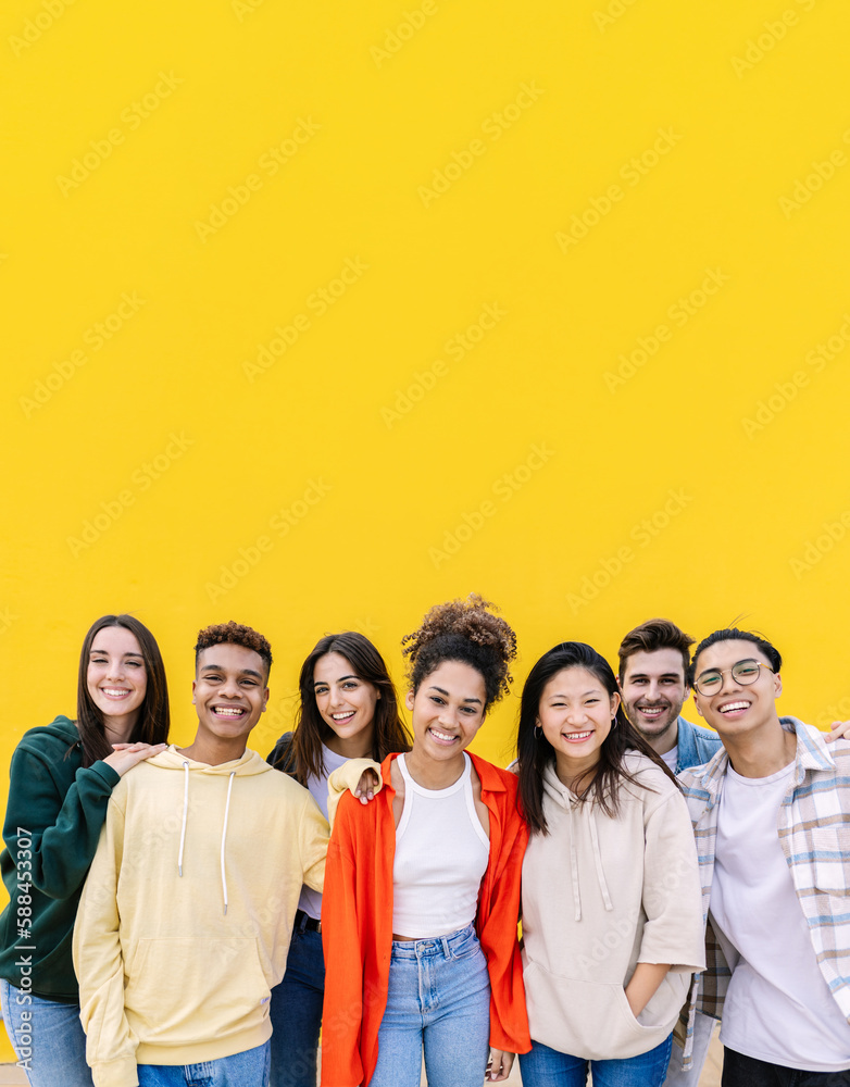 Happy young group of teenage people smiling at camera standing over ...