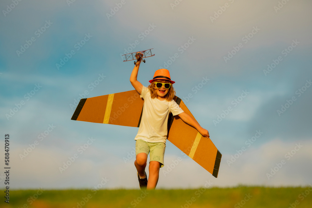 Child playing. Child boy toddler playing with toy airplane wings and ...