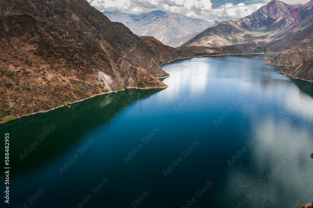 Aerial view from a drone, top-down, of a green-colored lagoon ...