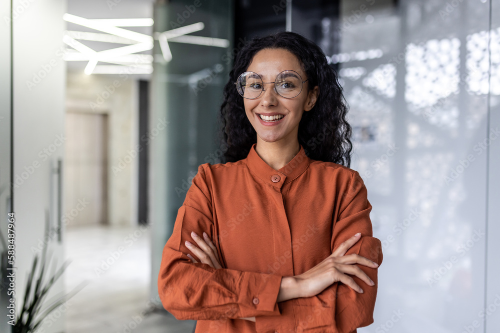 Young beautiful and successful hispanic businesswoman smiling and ...