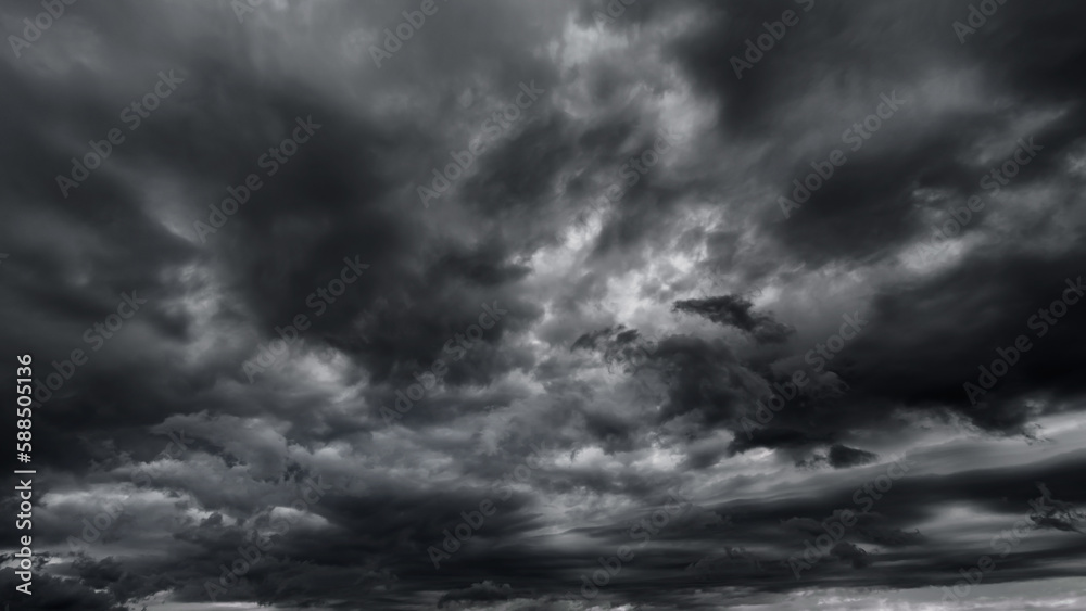 dark dramatic sky with black stormy clouds before rain or snow as ...