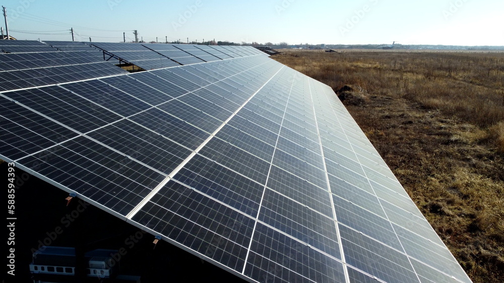 Solar power plant. Flight over modules of solar power station on sunny ...