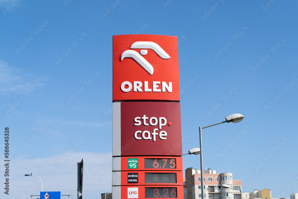 Orlen and Stop Cafe Bistro sign outside a petrol station. Logo at ...
