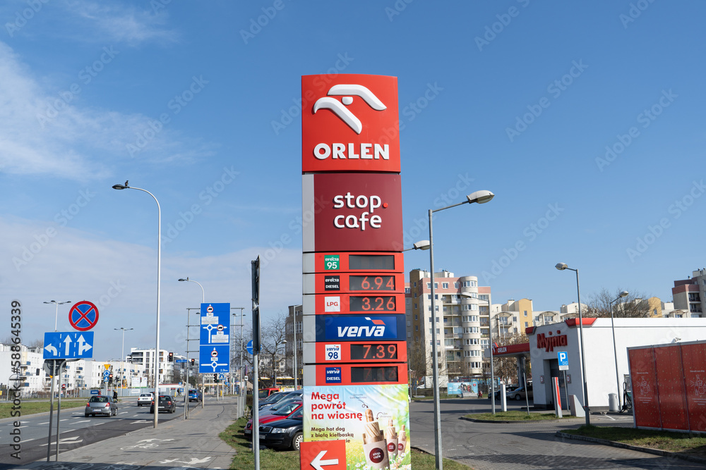 Orlen and Stop Cafe Bistro sign outside a petrol station. Logo at ...