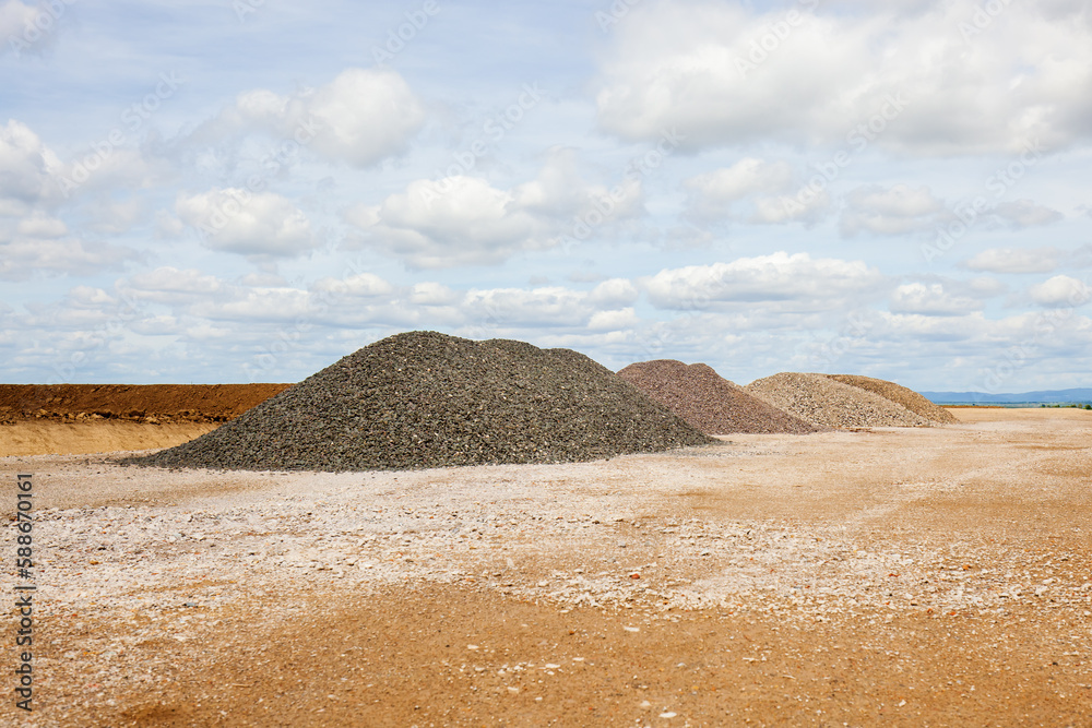 entrance construction site, driveway of building site. Pile of sand and ...