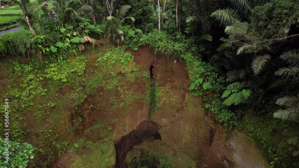 Deep ravine with vertical slope, view from air, camera flies back and ...