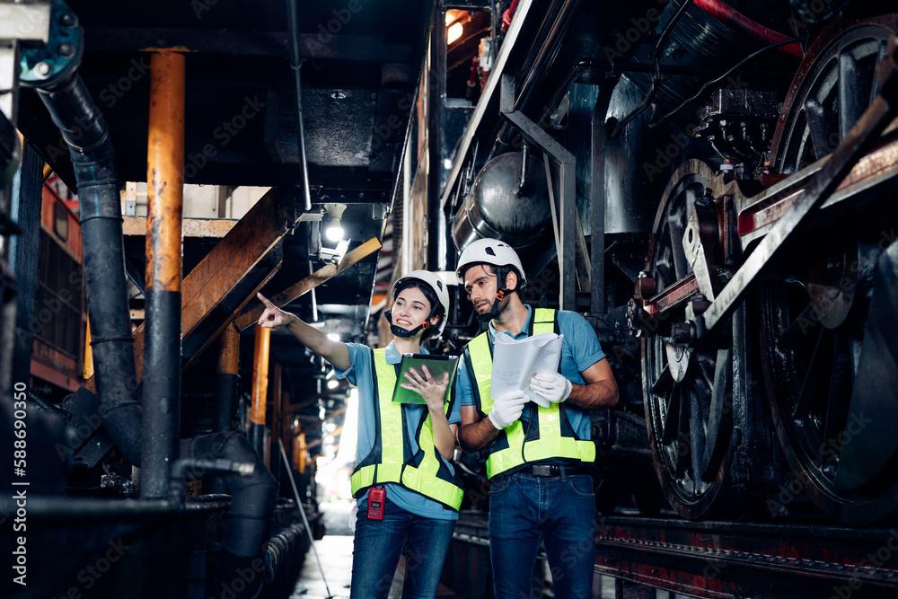 Team of engineer railway wearing safety uniform and helmet under ...